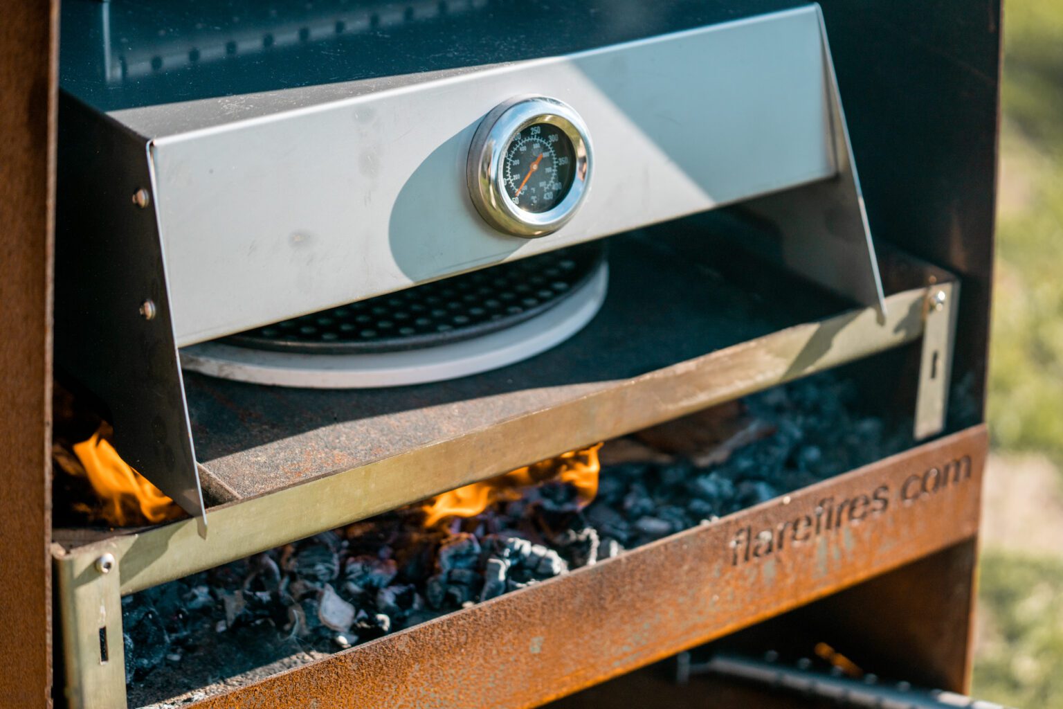 Dig the Martello Outdoor Fireplace concrete base into your lawn - Flare